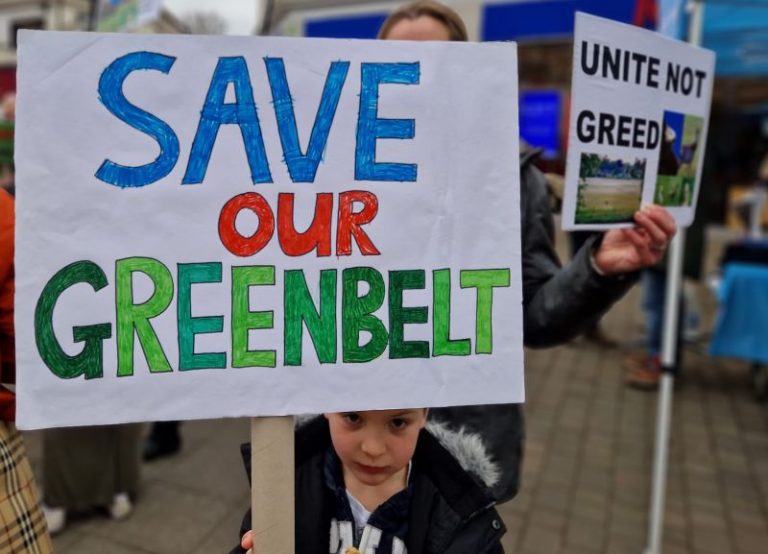 Red, blue and orange go Green in belt protest